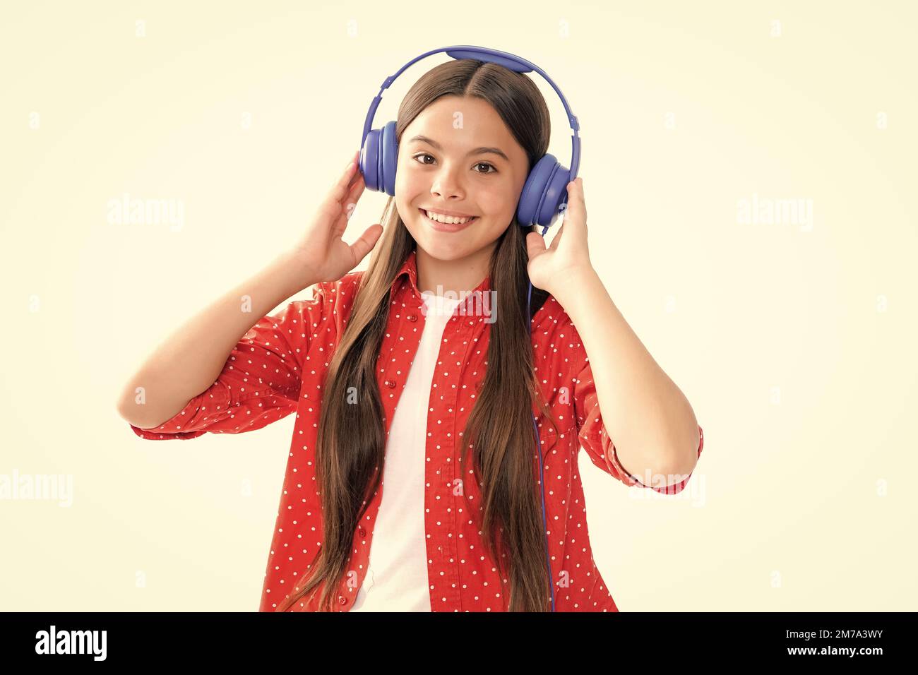 Teenager in modern wireless headphones enjoying song music in audio app ...
