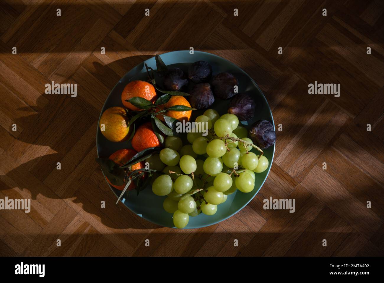 Different colorful organic fruits from the local farmer market on plate ...