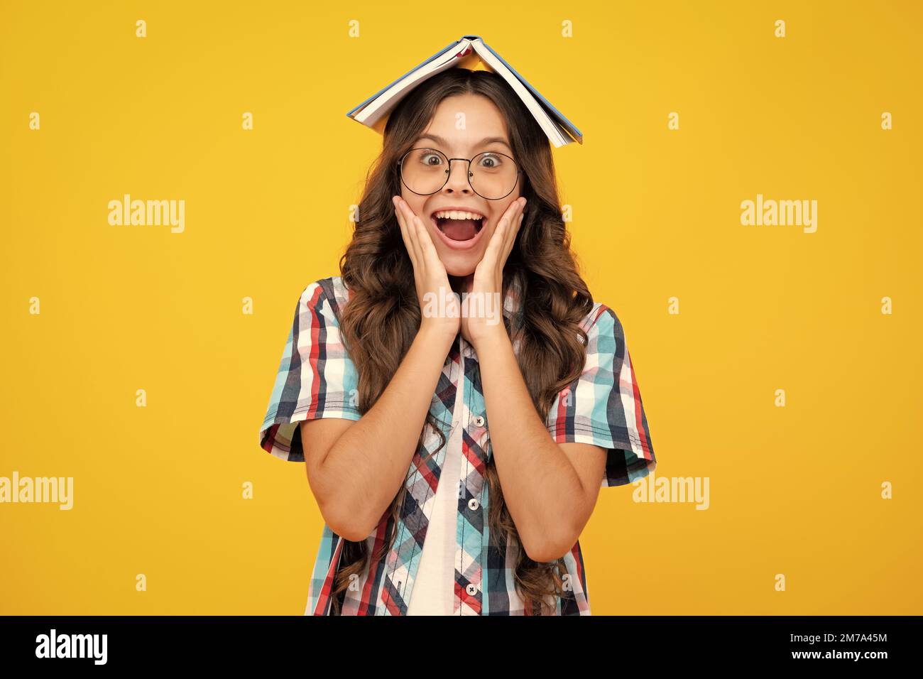 Amazed teen girl. Teenage school girl with books. Schoolgirl student ...