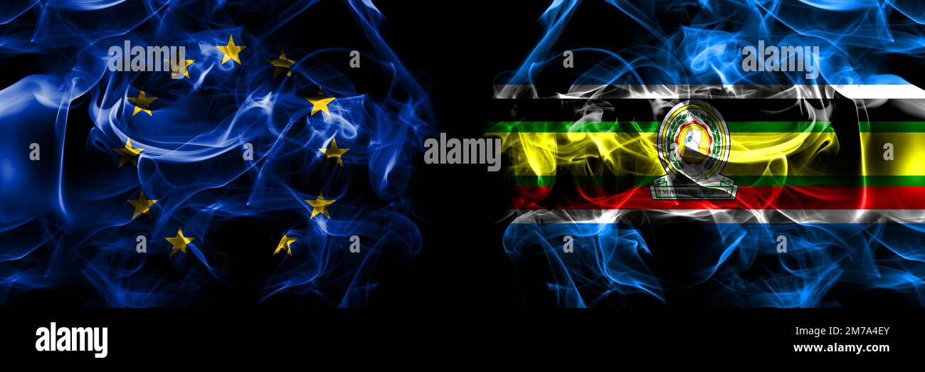 Flags of EU, European Union vs East African Community, Africa. Smoke ...