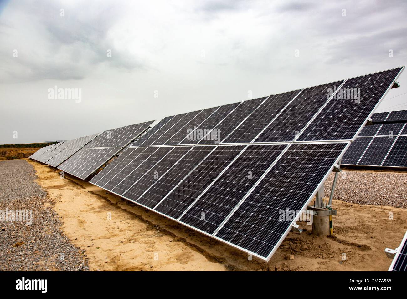 Black solar panels outdoors with a gloomy sky background Stock Photo ...