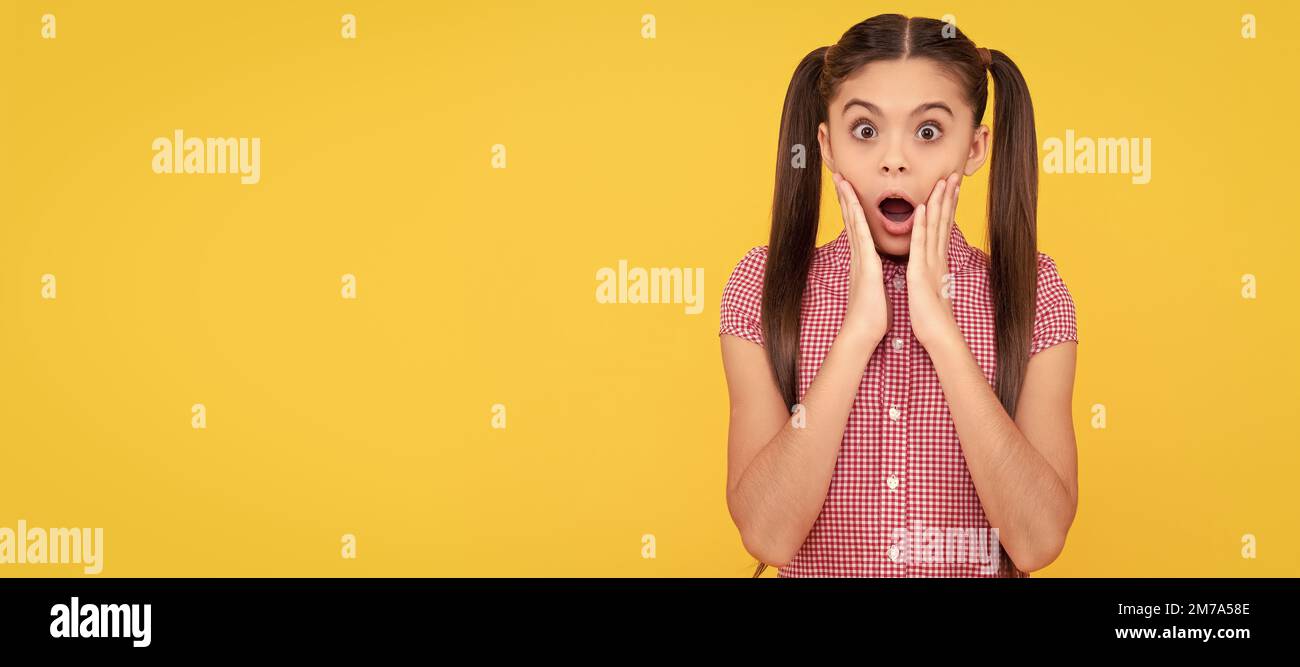 Kind of shocked. Kid got shocked. Surprised girl yellow background ...