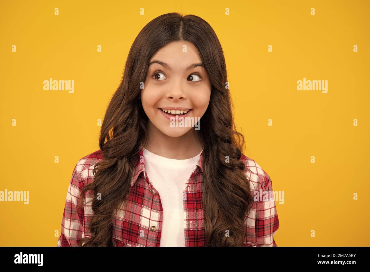 Funny face. Child little girl 12, 13, 14 years old background studio ...