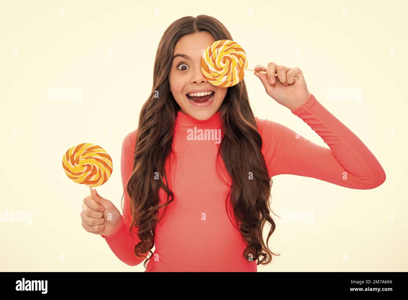 Teenager girl eating sugar lollypop. Candy and sweets for kids. Child ...