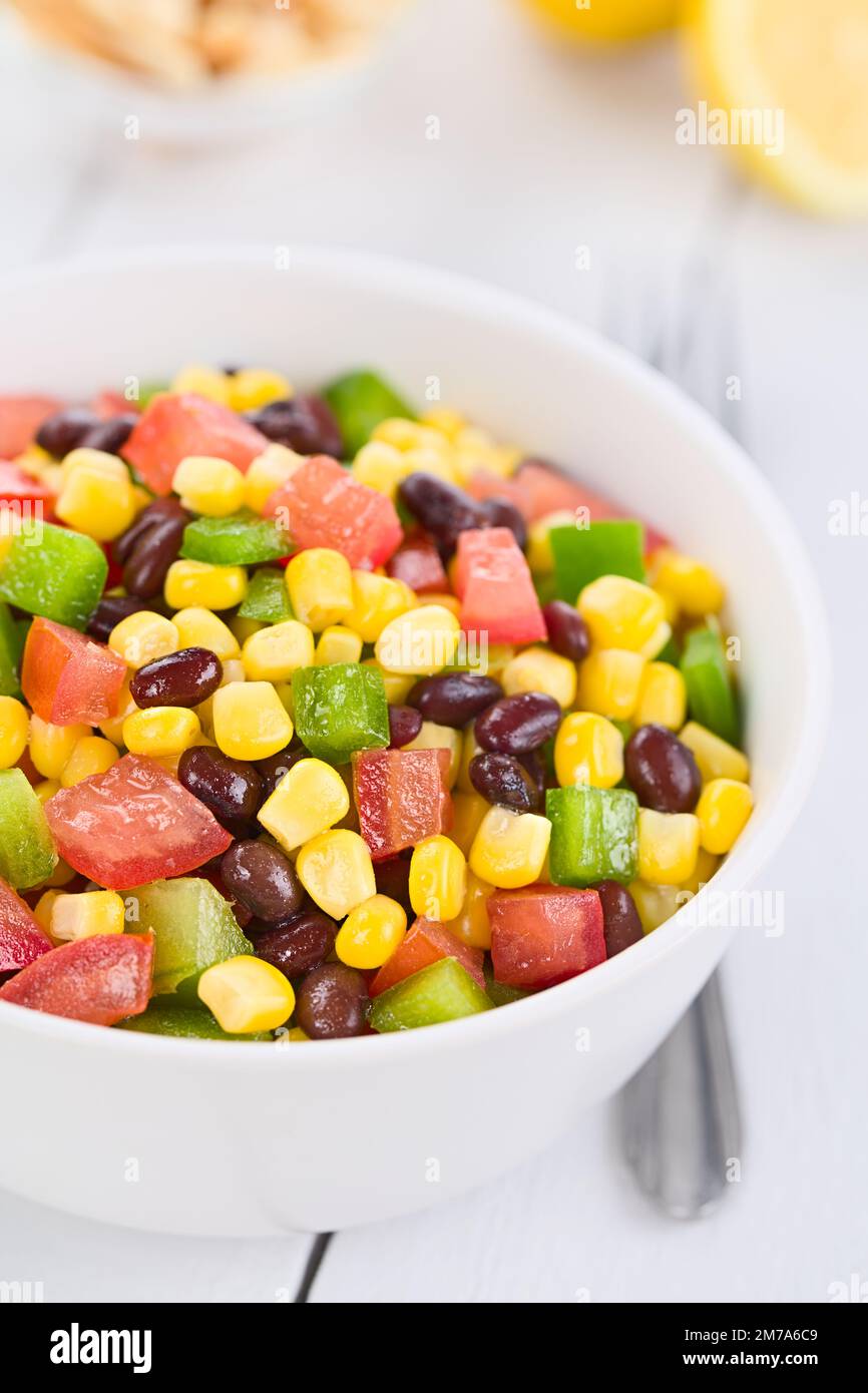 Mexican style colorful fresh vegetable salad made of beans, corn ...
