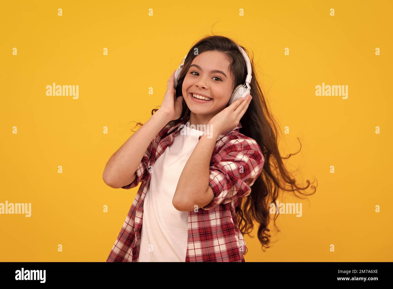 Teen girl in headphones listen to music. Wireless headset device ...