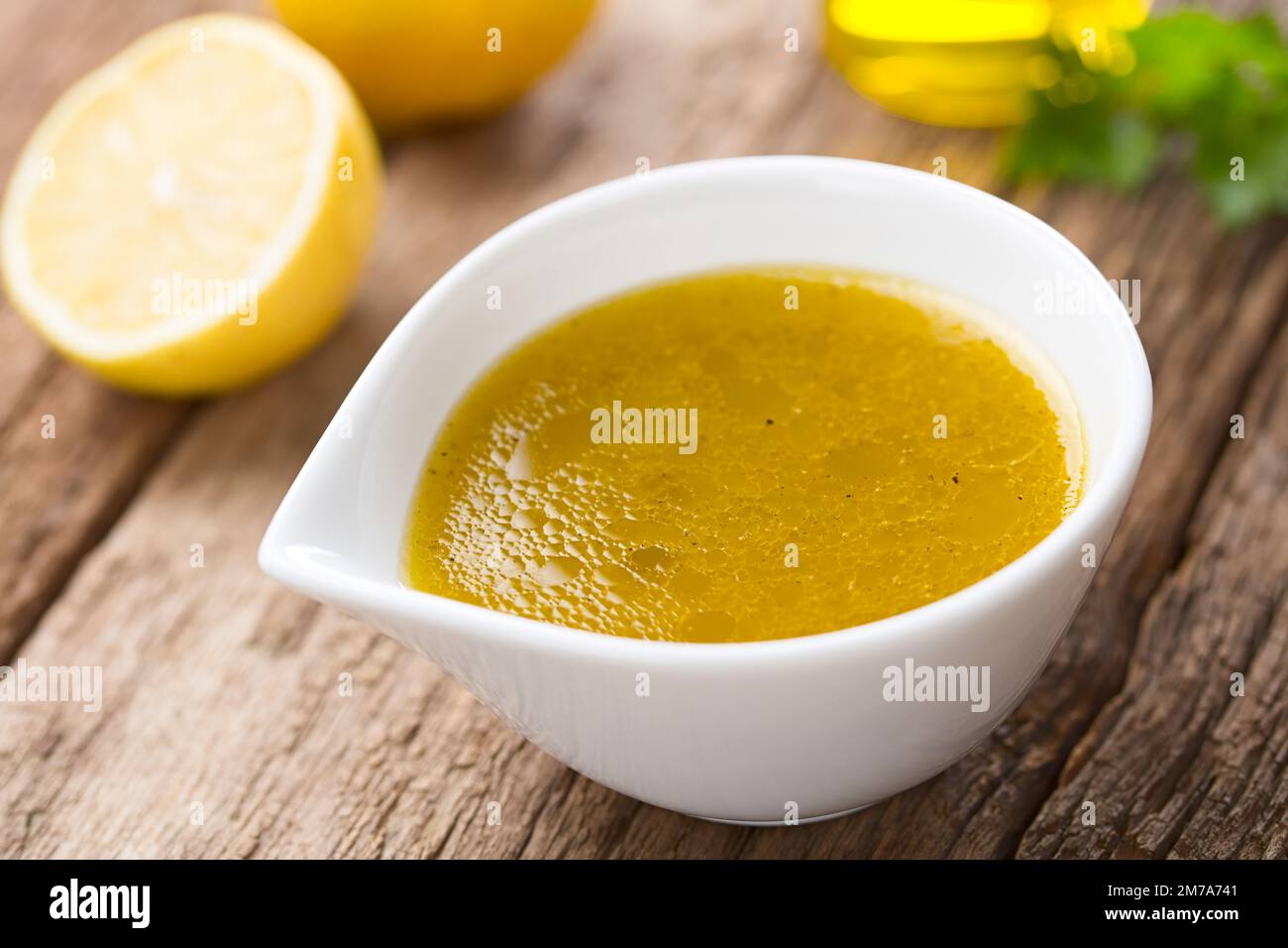 Fresh homemade vinaigrette salad dressing made of olive oil, lemon ...