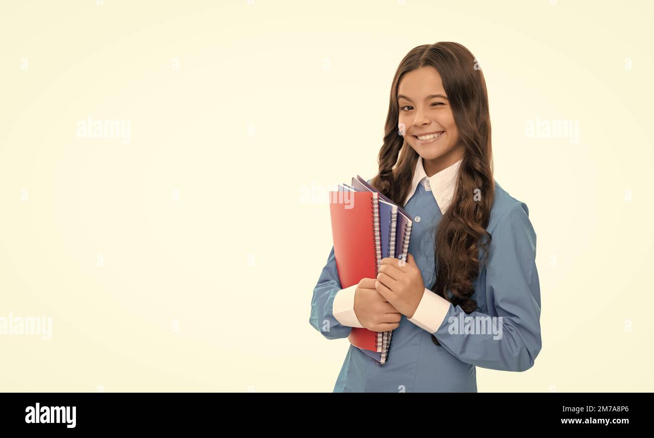happy kid portrait has long curly hair with school workbook isolated on ...