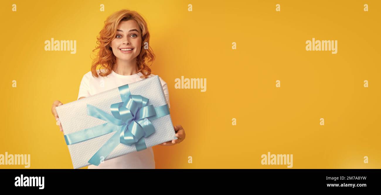 amazed happy redhead woman with gift box. anniversary. Beauty woman ...