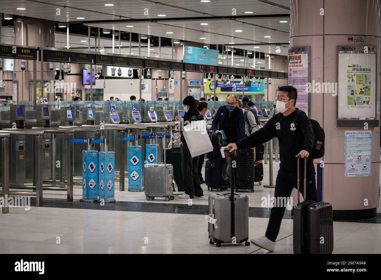 People seen crossing the border control as they departs to Shenzhen ...