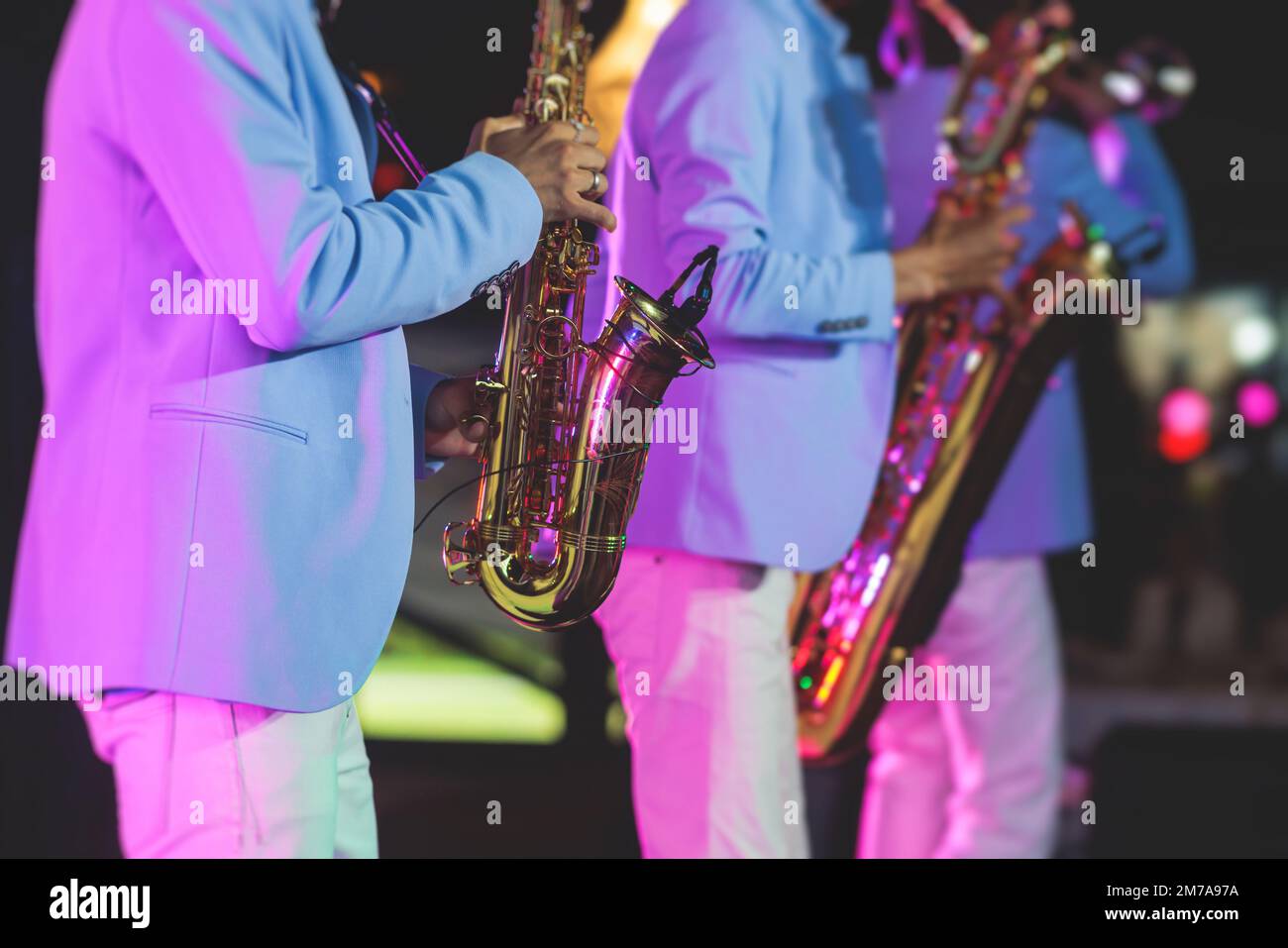 Concert view of saxophonist, a saxophone sax player with vocalist and ...