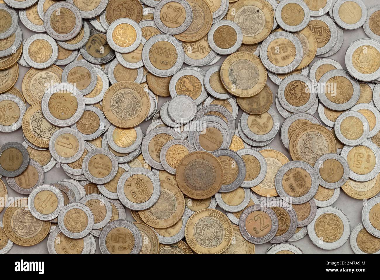 group of mexican peso coins of various denominations, with copy space ...
