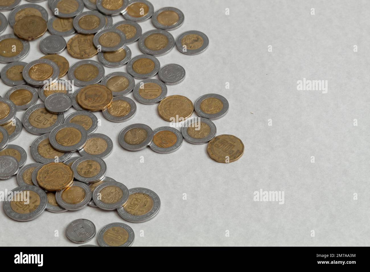 mexican peso coins scattered on the table with copy space Stock Photo ...
