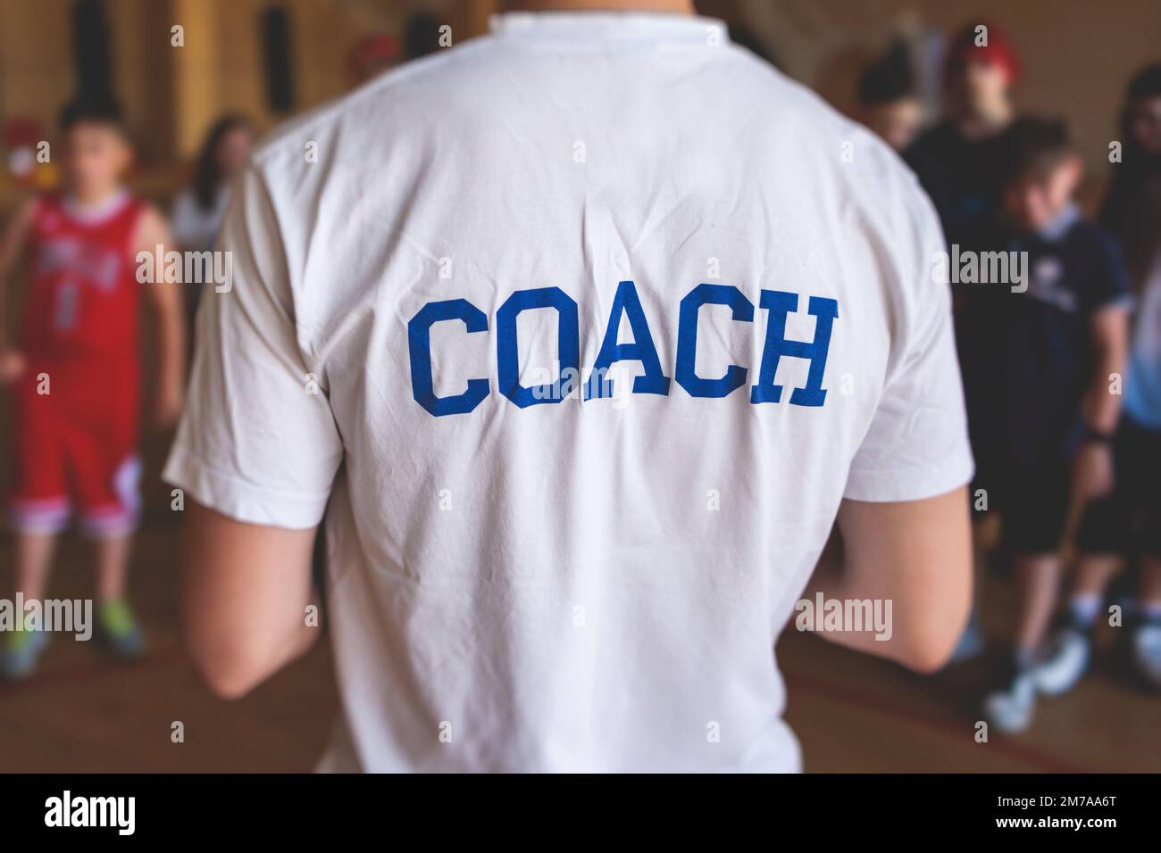 Junior young basketball team with a coach, group of kids children team ...