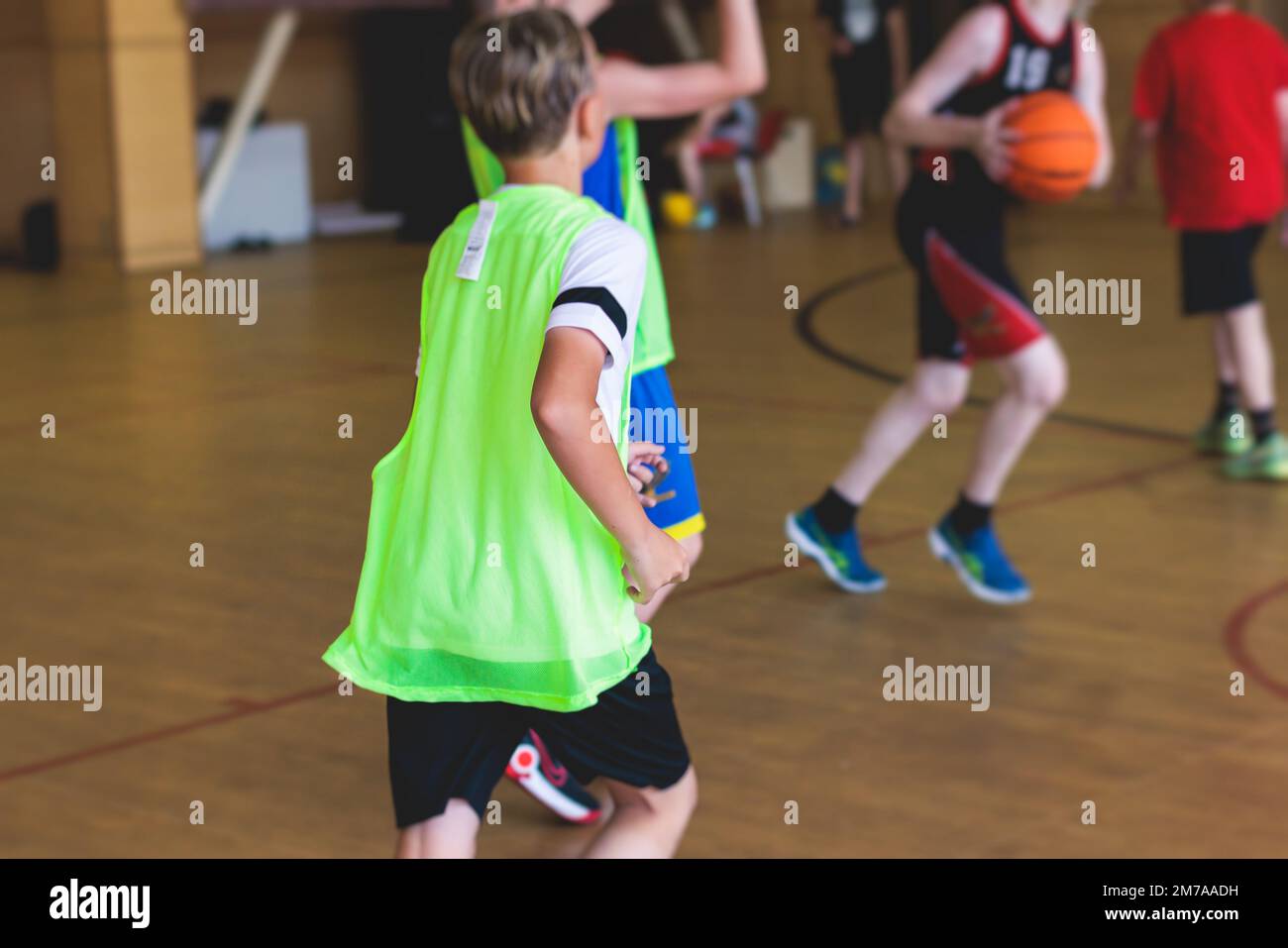 Junior teenage school team of kids children play basketball, players in ...