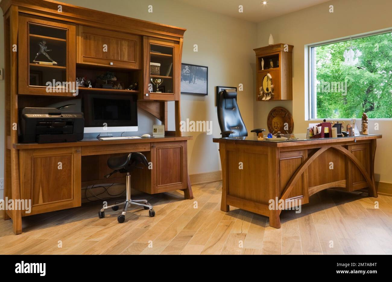 Cherry wood work desk and wall unit in office inside modern cubist ...