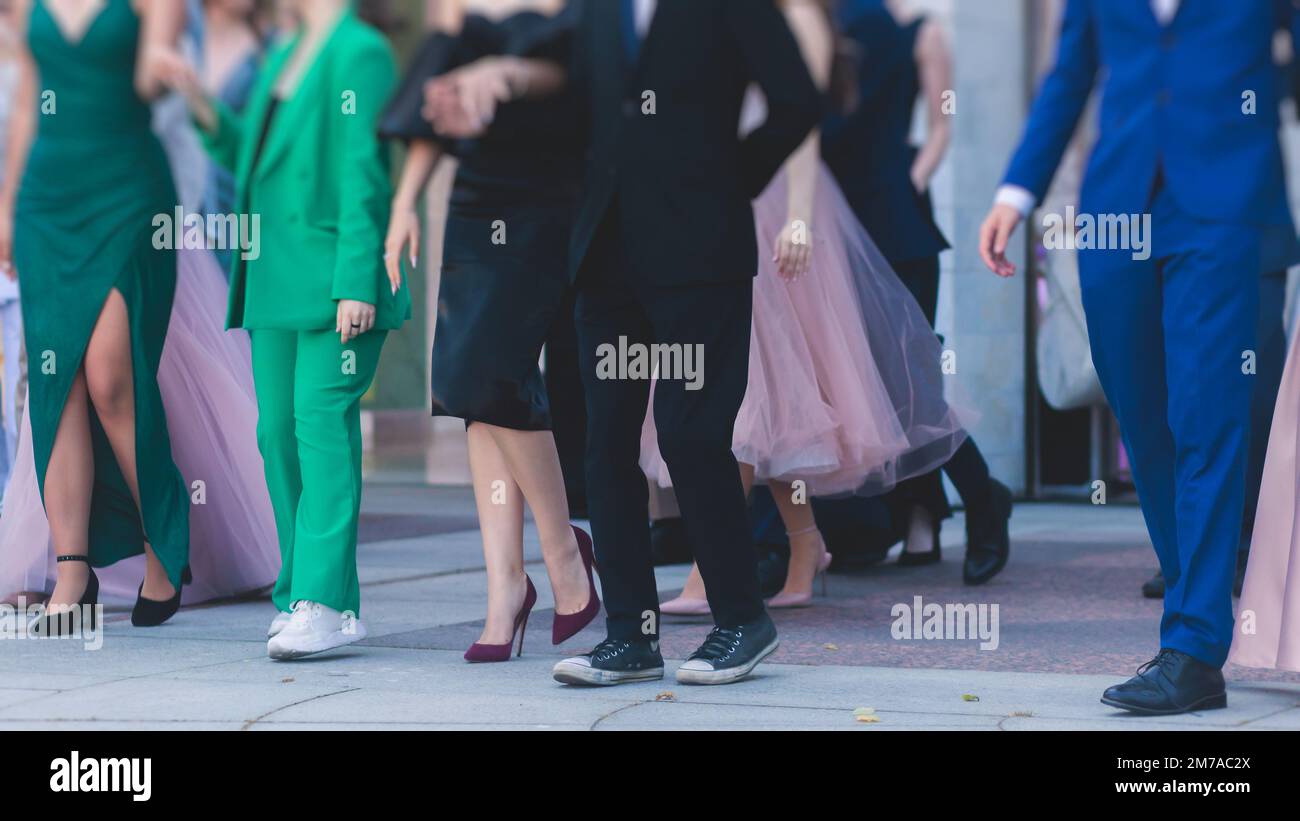 High school graduates dancing waltz and classical ball dance in dresses ...