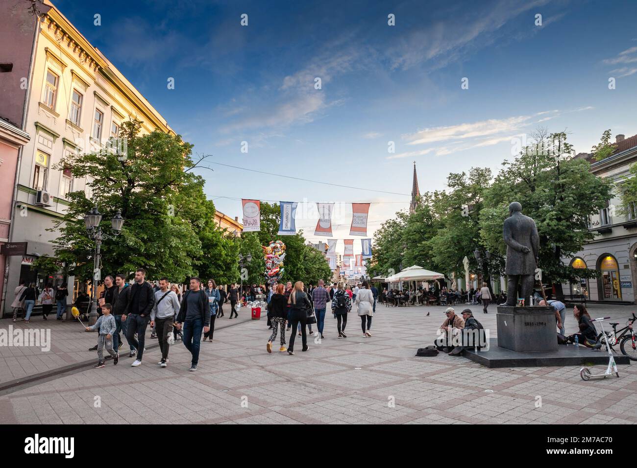 Picture of people passing by the pedestrian street of Zmaj Jovina Ulica ...