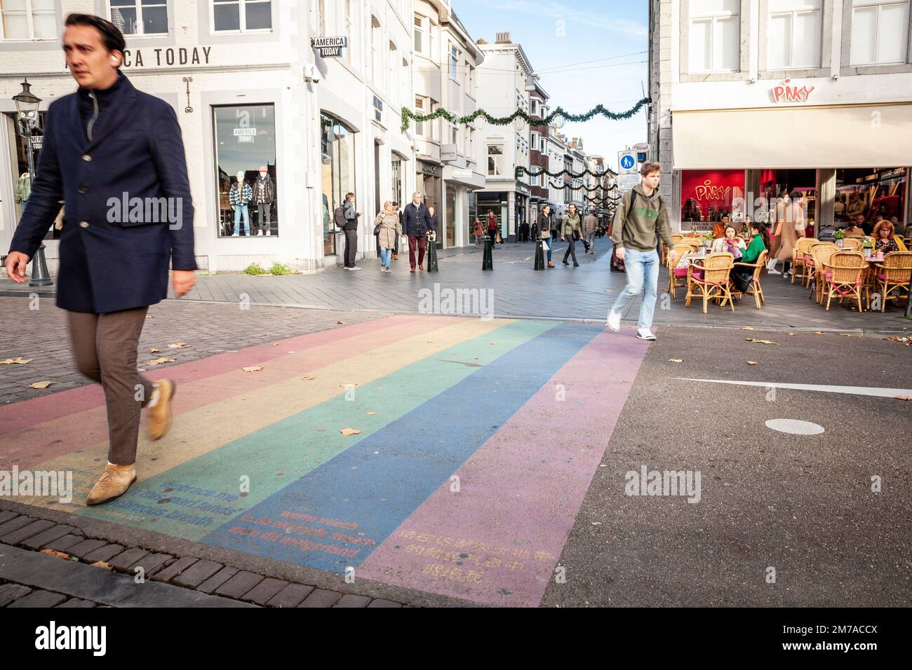 Picture of a rainbow flag painted on a street in the city center of ...