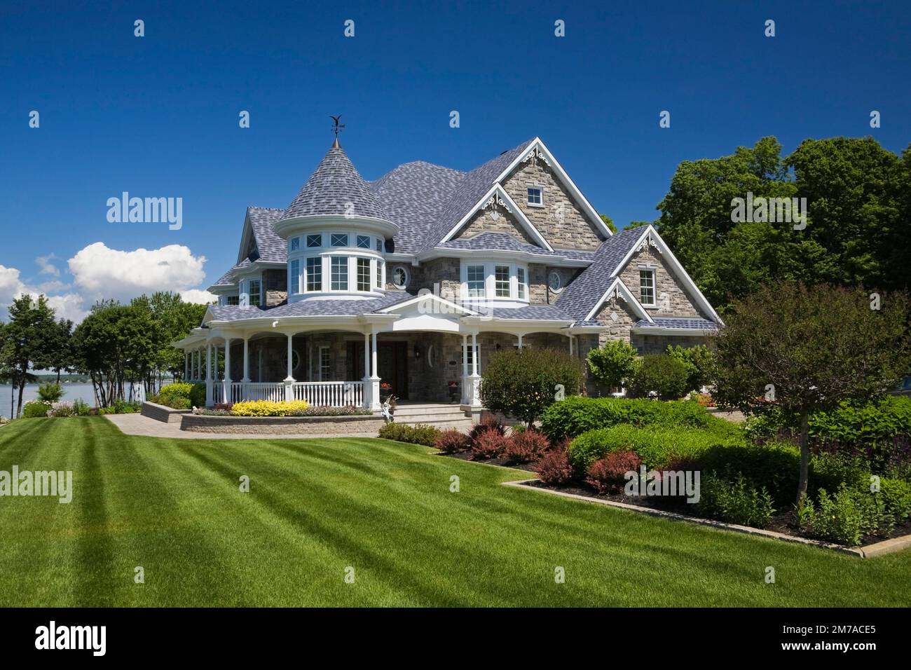 Elegant modern grey stone with white trim and blue roof Victorian style ...
