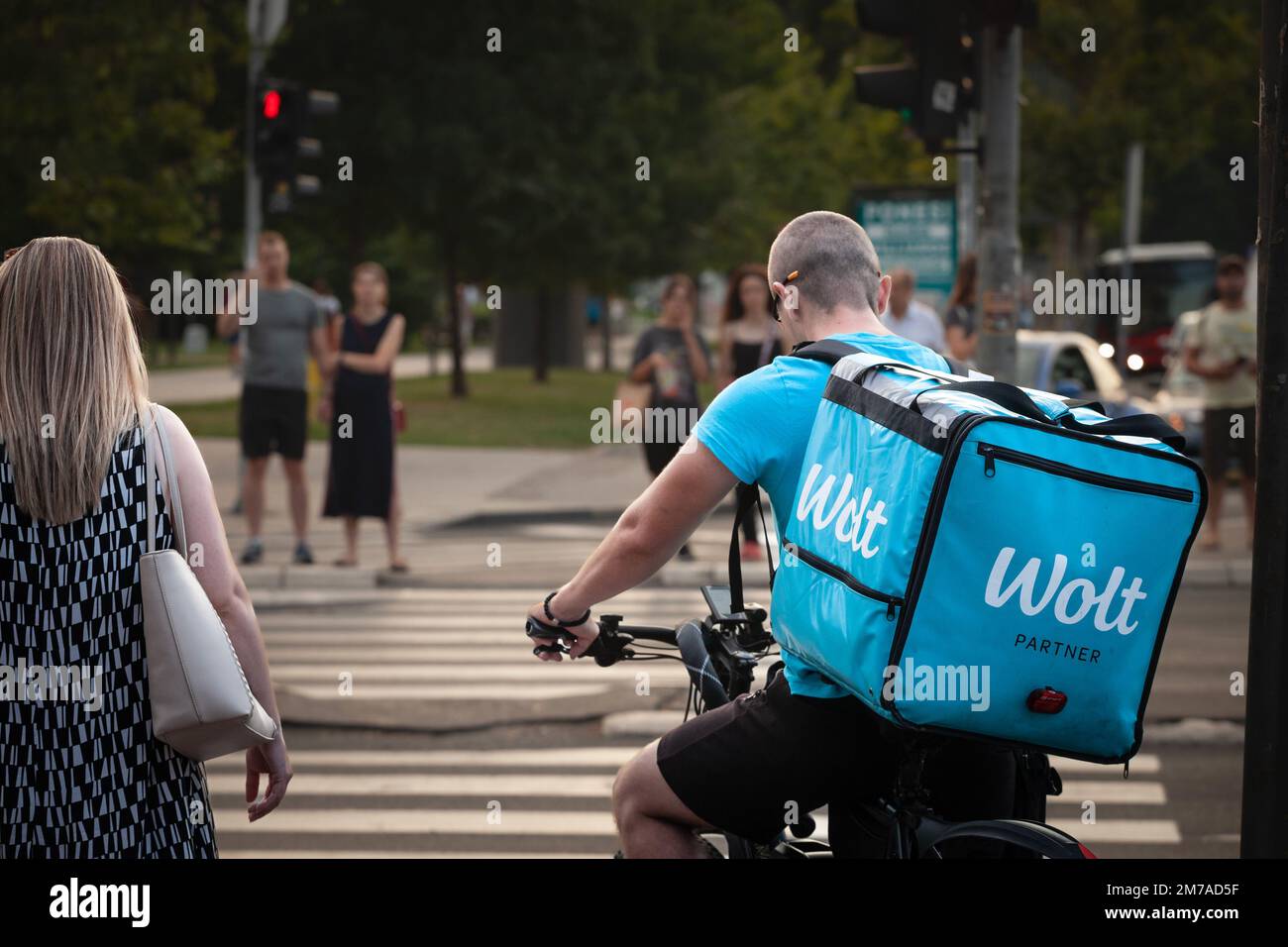 Picture of a food delivery guy from Wolt cycling in the streets of ...