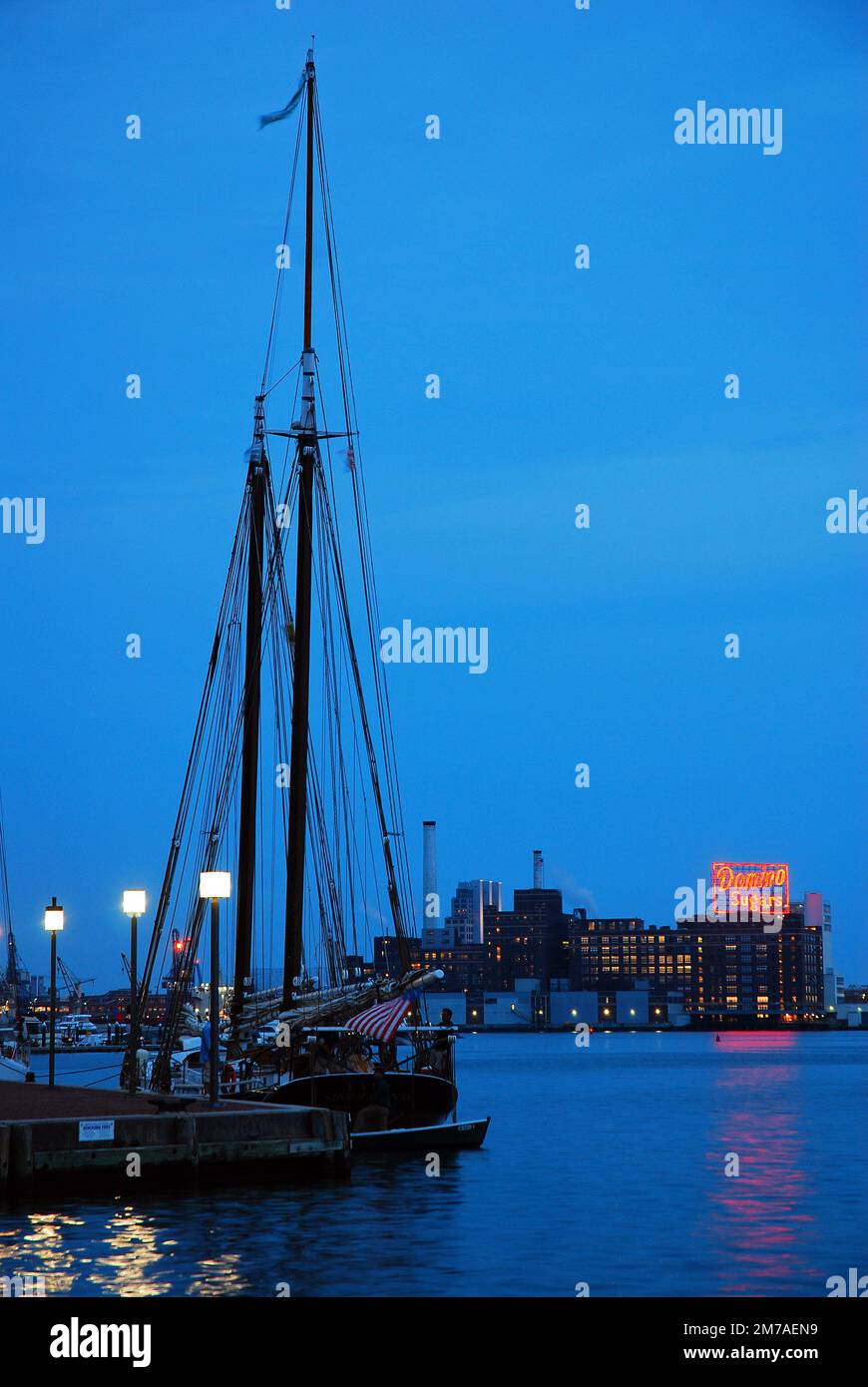 A historic schooner is docked at dusk in Inner Harbor, Baltimore Stock ...