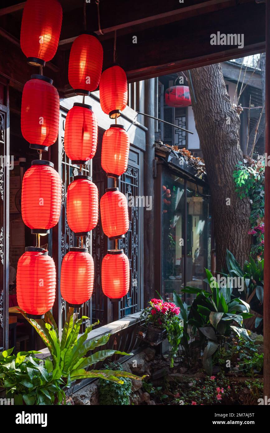 Red Chinese lantern hanging on an ancient Chinese house Stock Photo - Alamy