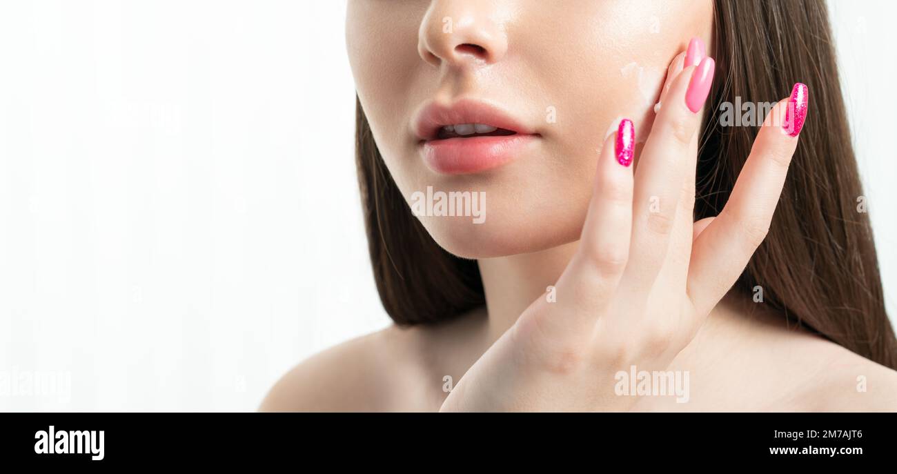 Beauty woman applying face cream on clean fresh skin, moisturize and ...