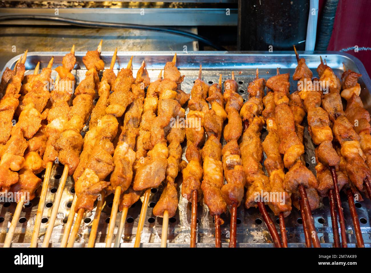 Grilled meat on sticks skewers in a chinese market Stock Photo - Alamy