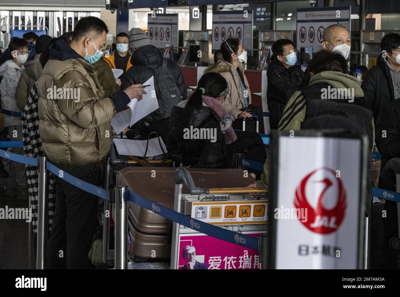 **CHINESE MAINLAND, HONG KONG, MACAU AND TAIWAN OUT** Passengers wait ...