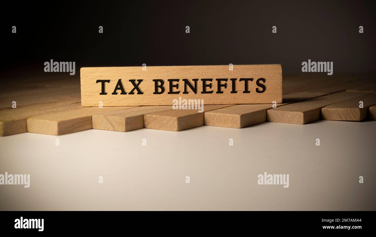 TAX Benefits text. It was taken in the studio written on a wooden frame ...