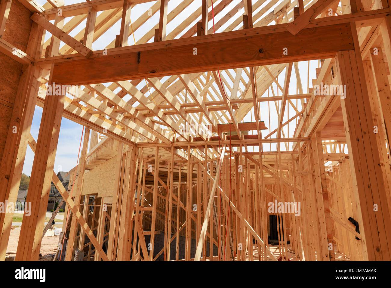 Getting the framework for new house up and running Stock Photo - Alamy