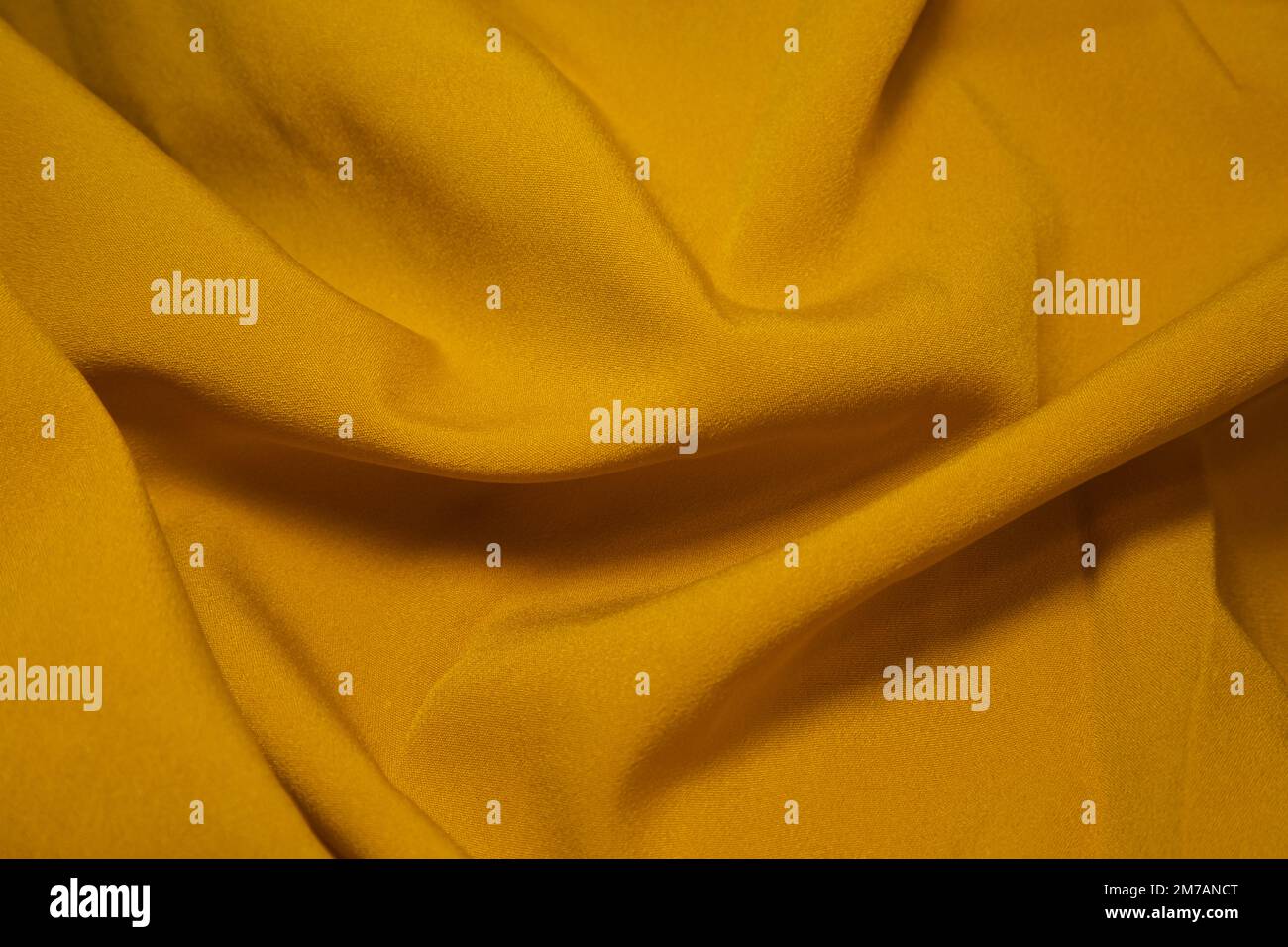 Yellow fabric background. Yellow cloth waves background texture. Yellow ...