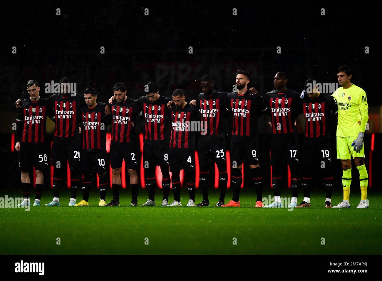 Milan, Italy. 08 January 2023. Players of AC Milan observe a minute's ...