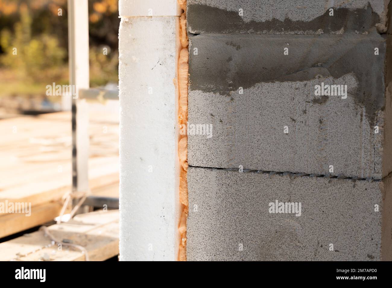 A thick white polystyrene foam sheet is glued to an aerated concrete ...