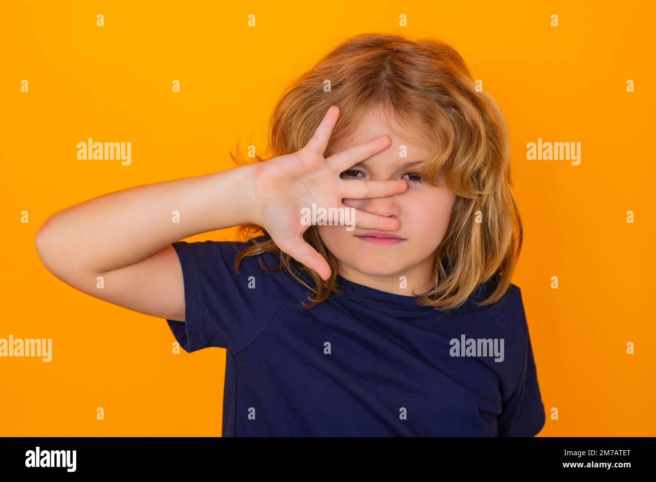 Child boy making stop gesture on isolated studio background. Kid ...