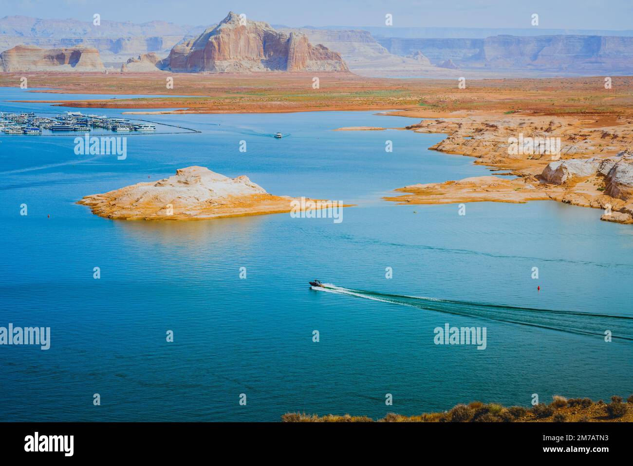 Lake Powell overlook. Morred boats, blue water, and red rocks, Southern ...
