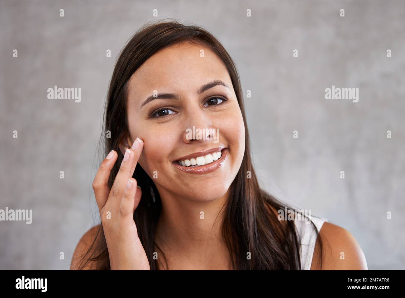 My skins looking great. An isolated portrait of a beautiful young woman ...