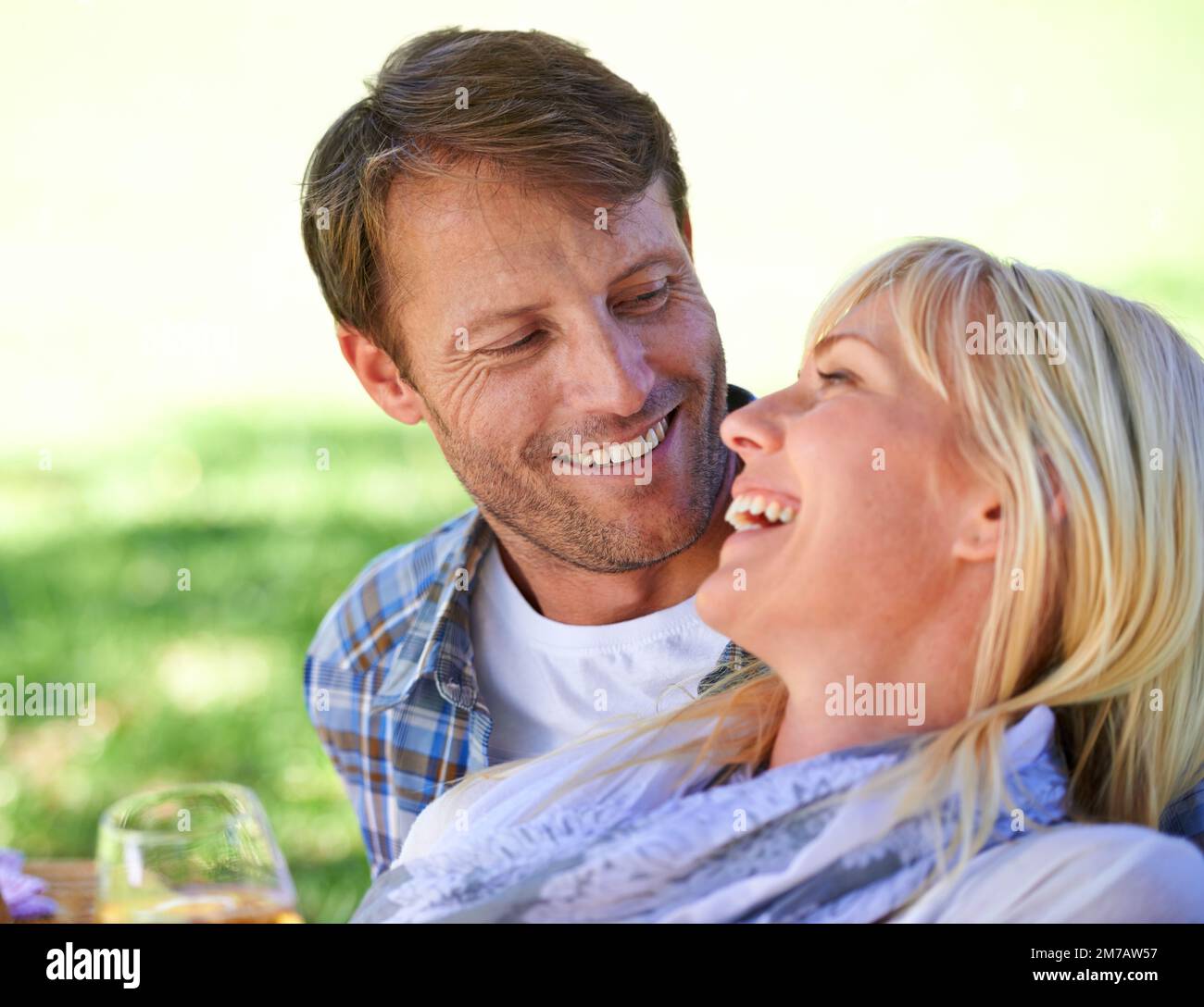 Enjoying a romantic day outdoors. an affectionate couple enjoying a ...