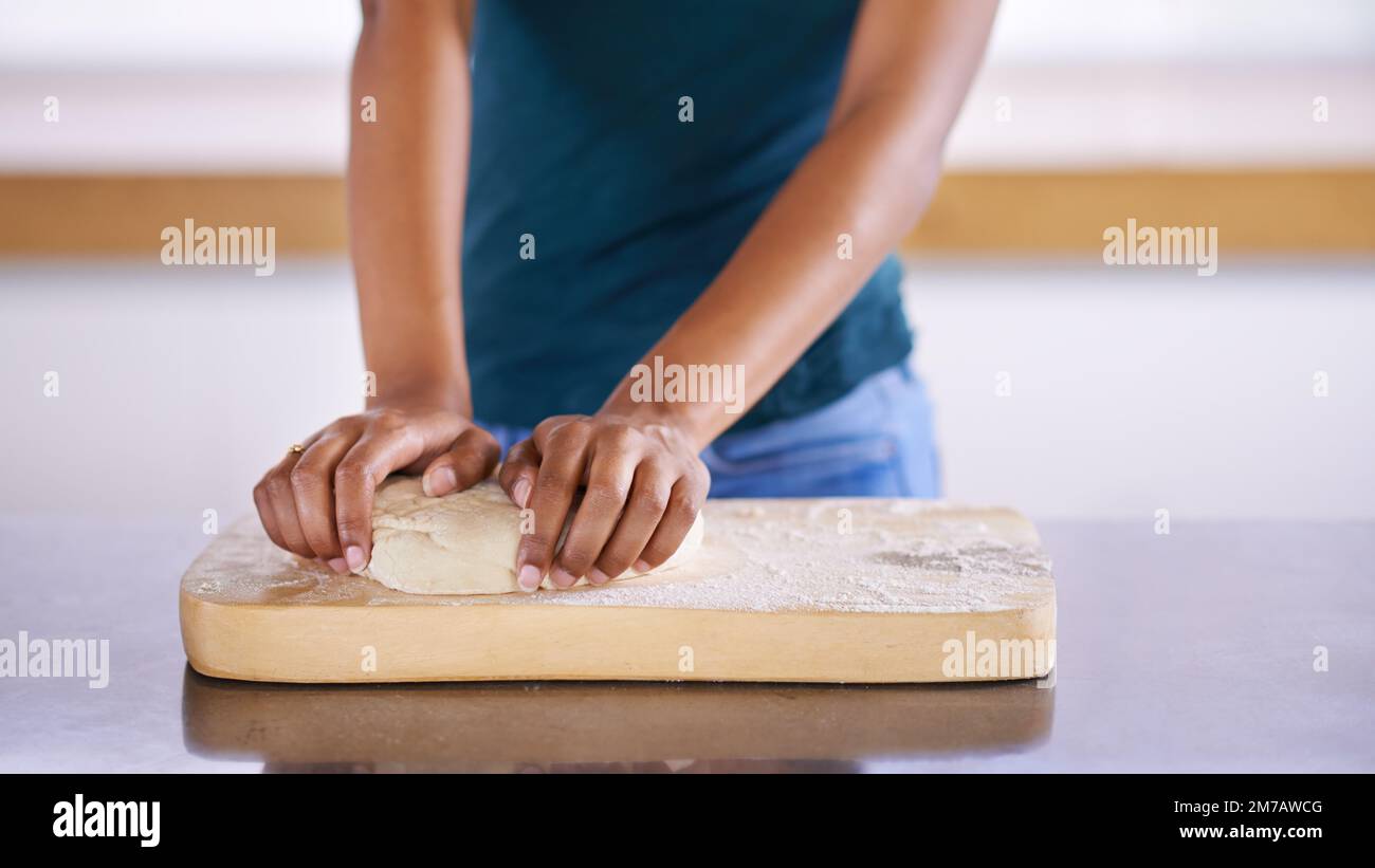 The hands of a baker. a young woman pressing dough Stock Photo - Alamy