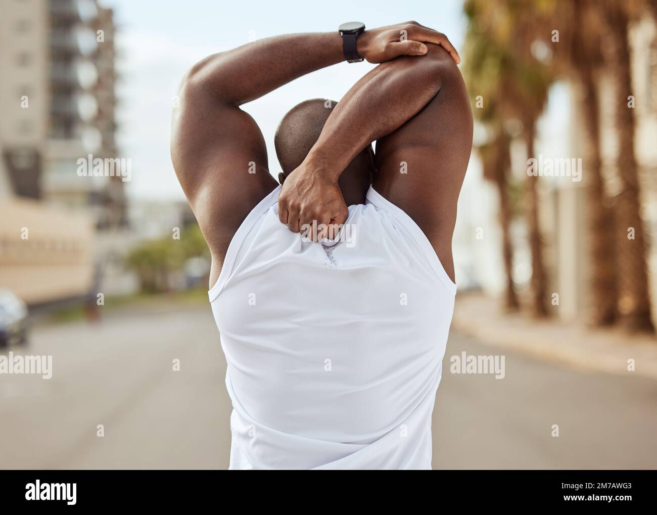 Back, black man and stretching in city, exercise and workout for ...