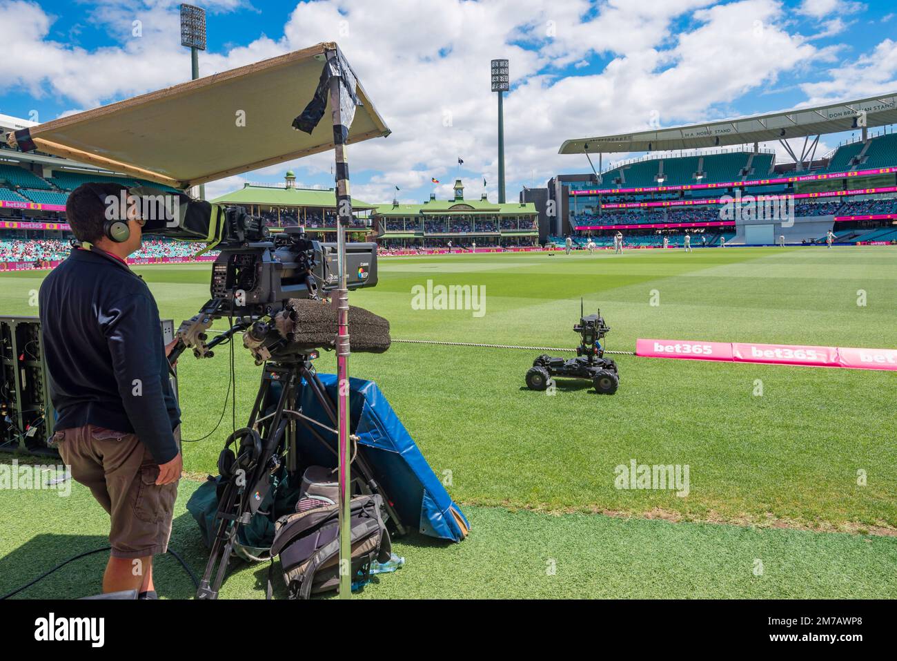 An outside broadcast television cameraman and remote controlled camera ...