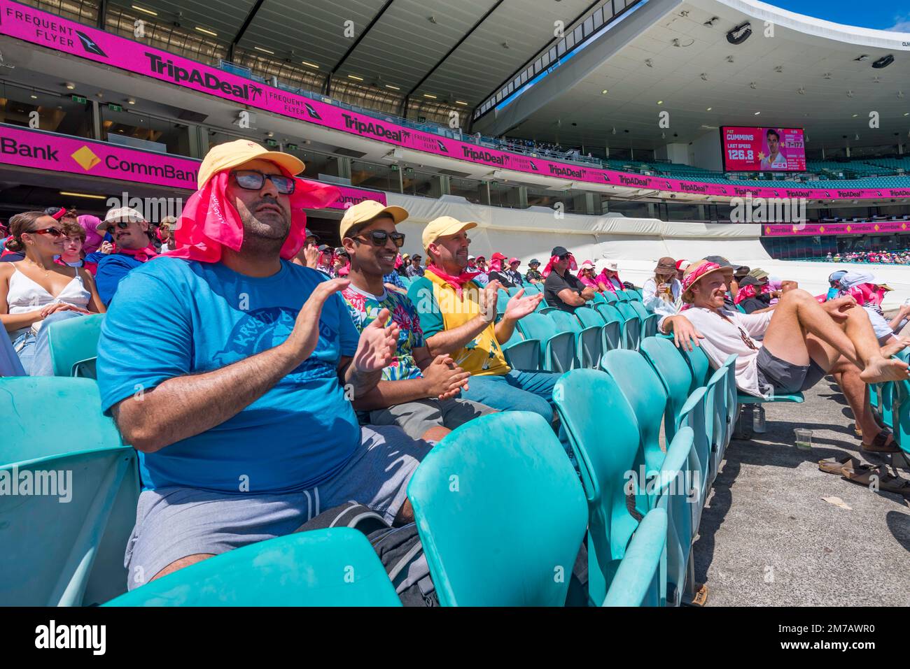 Jan 2023: Three young Australians wearing pink and watching play at the ...