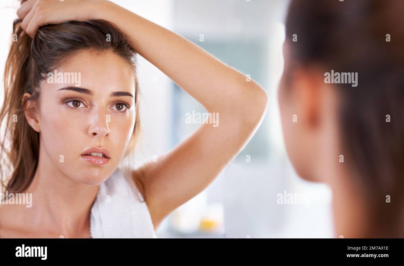 Judging beauty. Over the shoulder shot of an attractive young woman ...