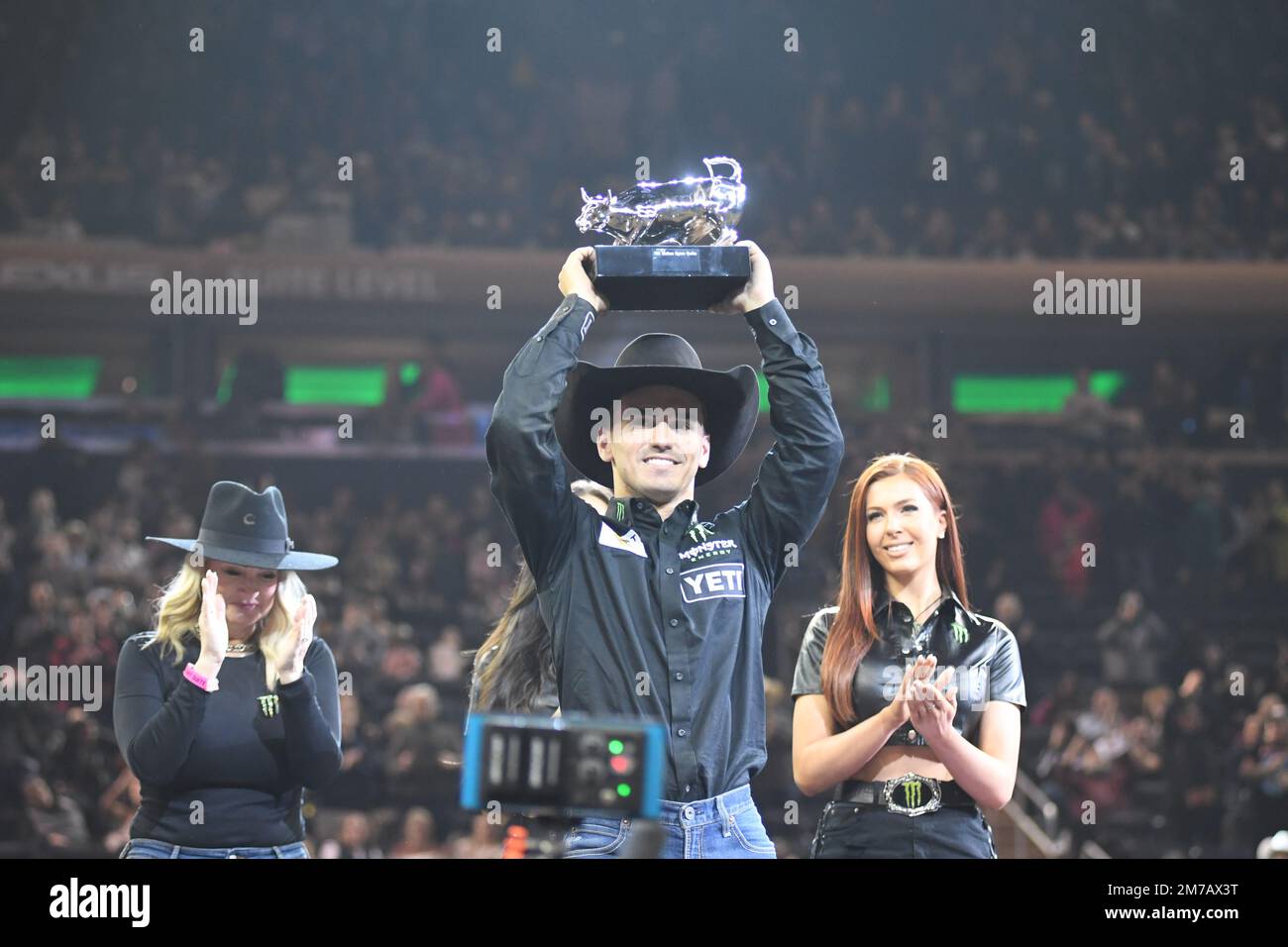 Professional Bull Rider Jose Vitor Leme is presented a trophy after ...