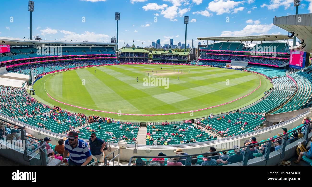 A relatively small crowd of Australians wearing pink and watching the ...