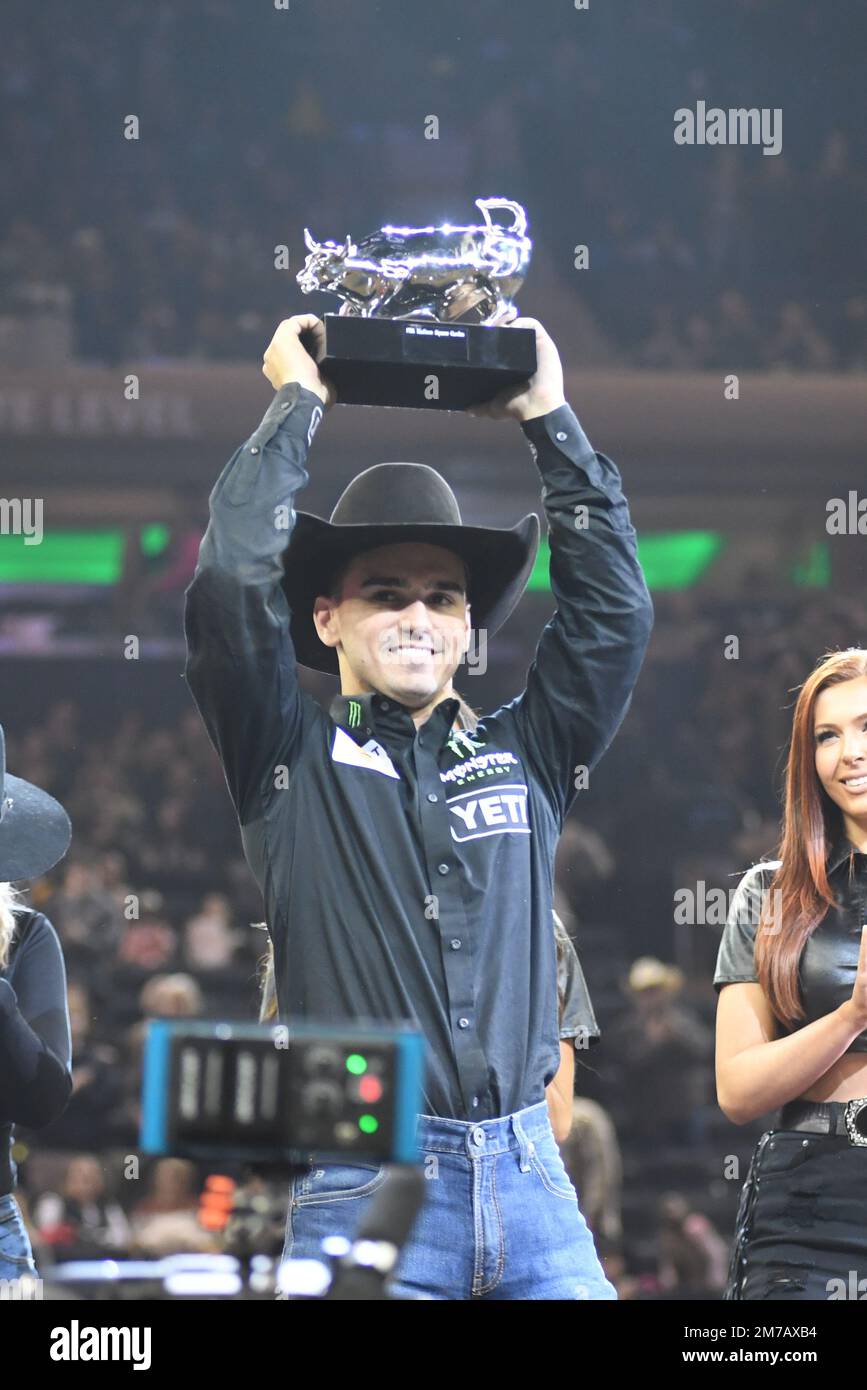 Professional Bull Rider Jose Vitor Leme is presented a trophy after ...