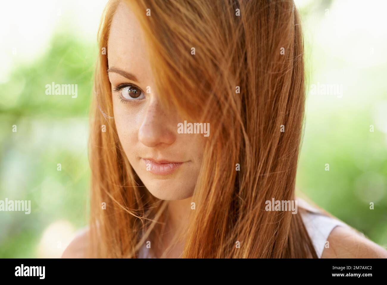 Shes a blossoming beauty. Closeup portrait of a pretty teenage girl in ...