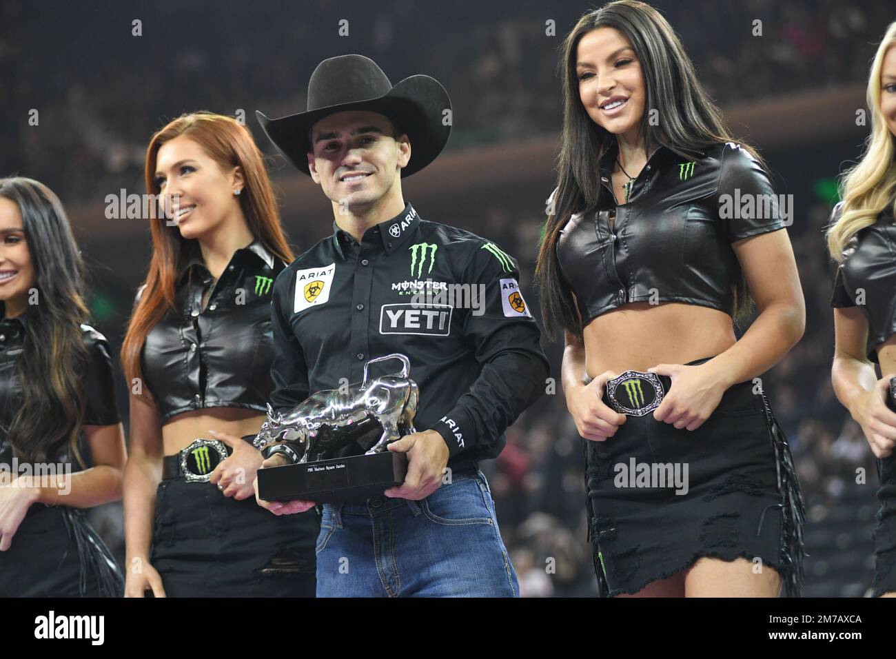 Professional Bull Rider Jose Vitor Leme is presented a trophy after ...
