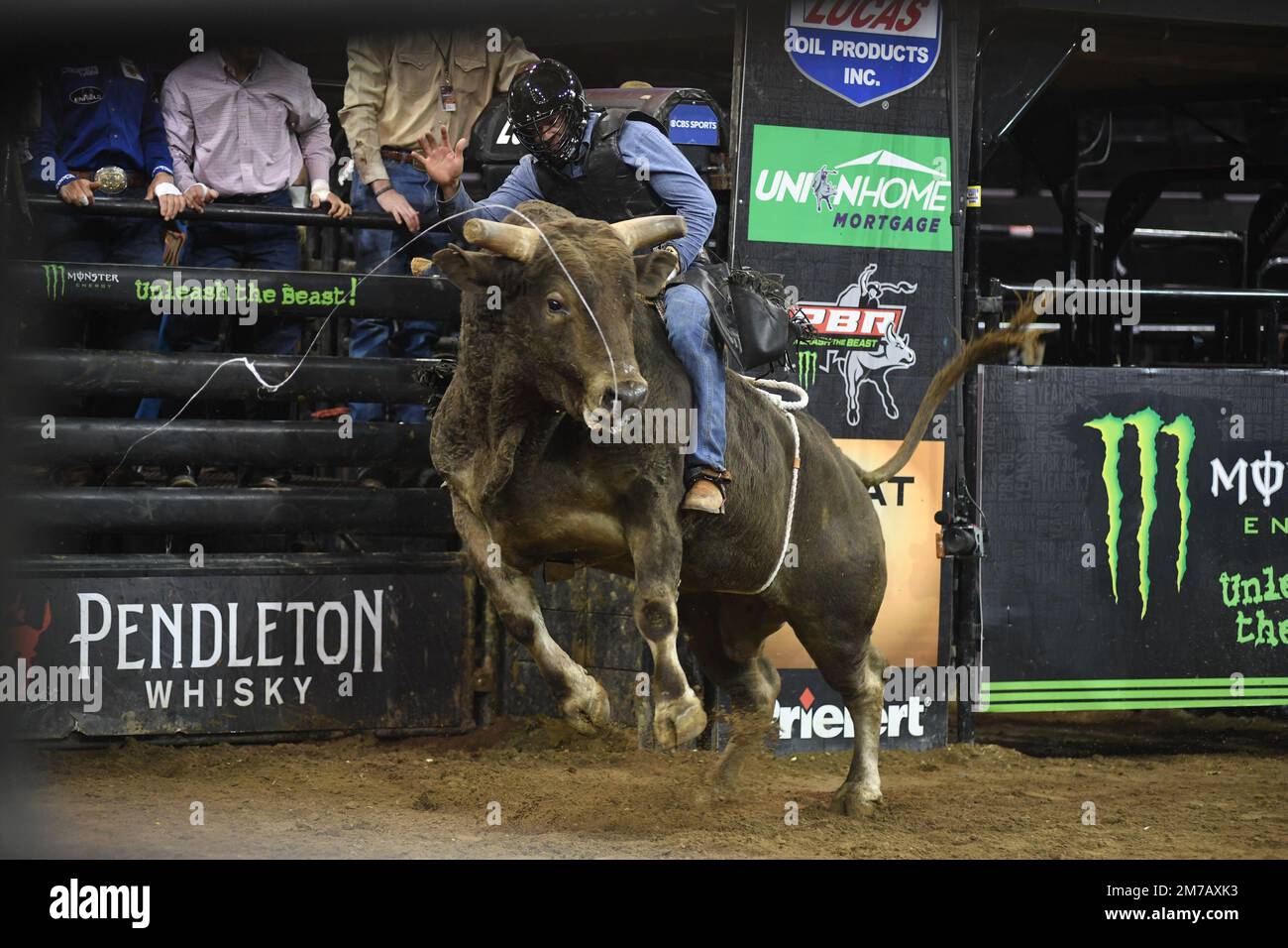 Professional Bull Rider Alex Cerqueira rides bull Five Knuckle Shuffle during PBR Monster Energy ...